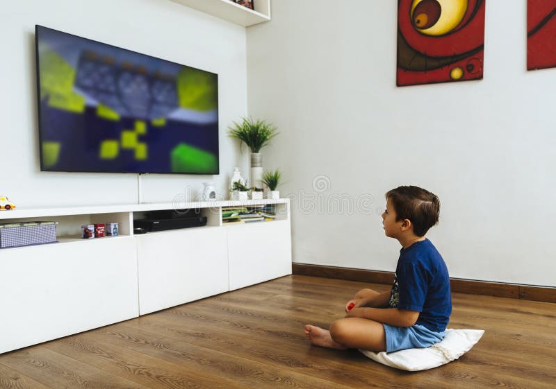 Lonely Boy Watching Television in a Living Room Stock Photo - Image of ...