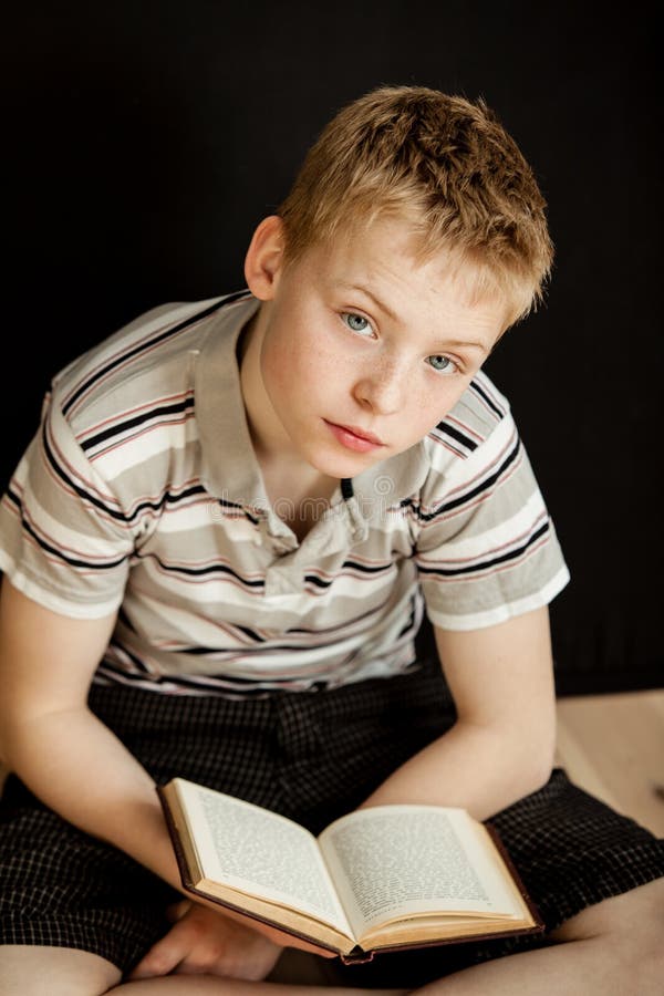 Lonely Child Sitting and Reading a Book Stock Image - Image of calm ...