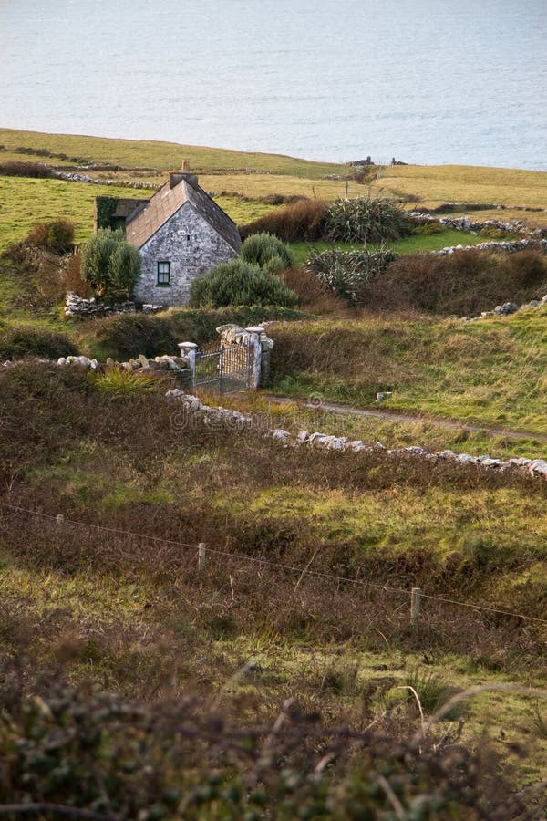 Lonely cottage by the sea stock photo. Image of clare - 20662500