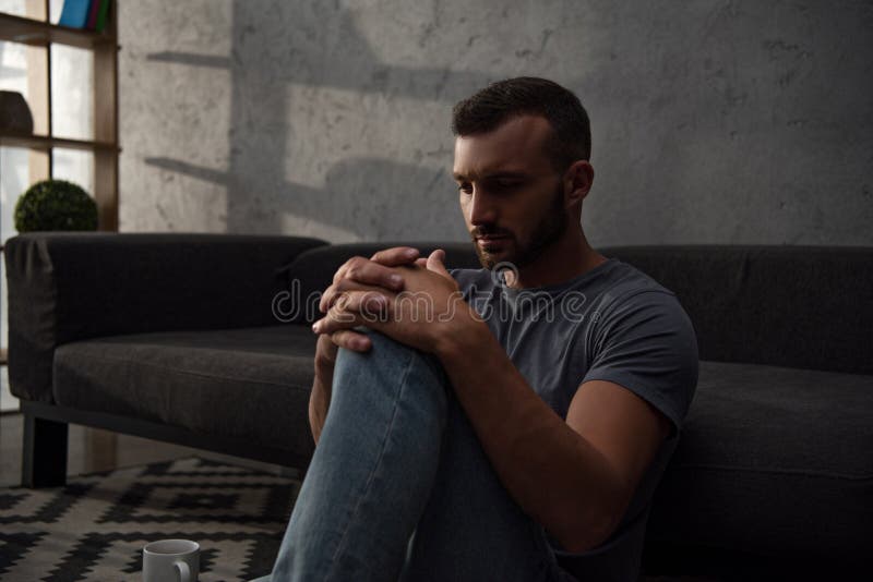 Lonely Depressed Man Sitting Stock Photo - Image of lonely, emotion ...