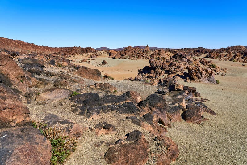 A Lonely Desert Area with Rocks of Different Sizes and Sand Stock Photo ...