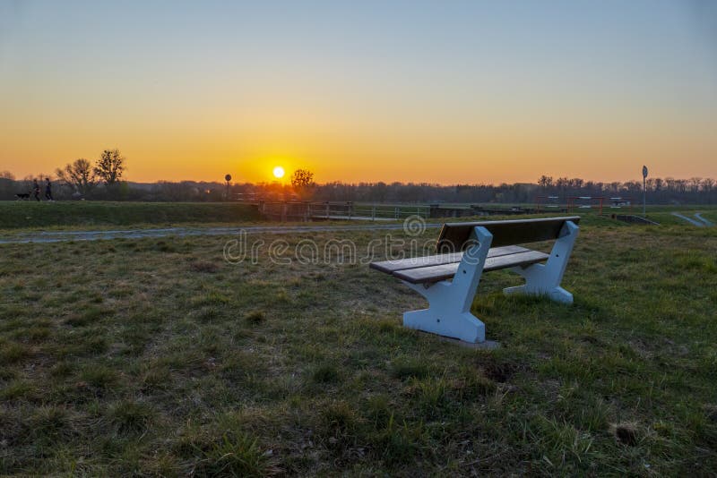 Lonely Empty Bench on a Meadow, in the Sunset Stock Image - Image of ...
