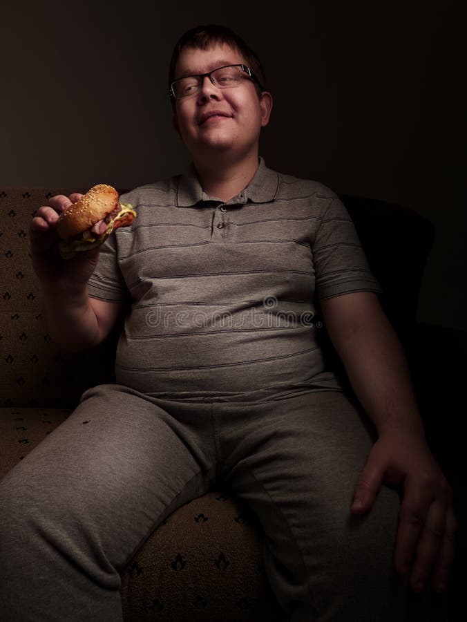 Lonely Fat Guy Eating Hamburger. Bad Eating Habits. Closeup. Stock ...