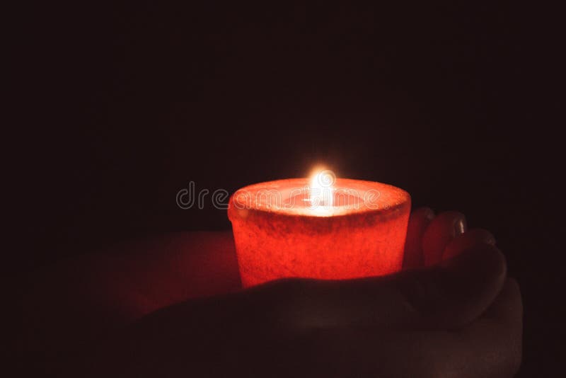 Lonely Flame Burning Red Candle in Hand in the Dark Stock Image - Image ...