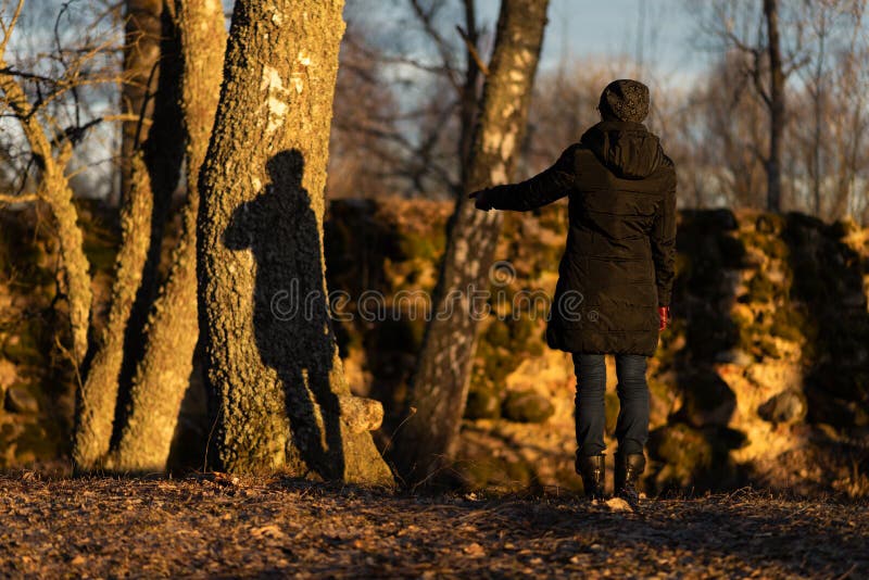 Lonely Girl and Shadow on a Tree Stock Image - Image of abstract, rock ...