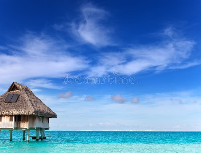 Lonely Hut Over the Blue Ocean Stock Image - Image of polynesia, lagoon ...