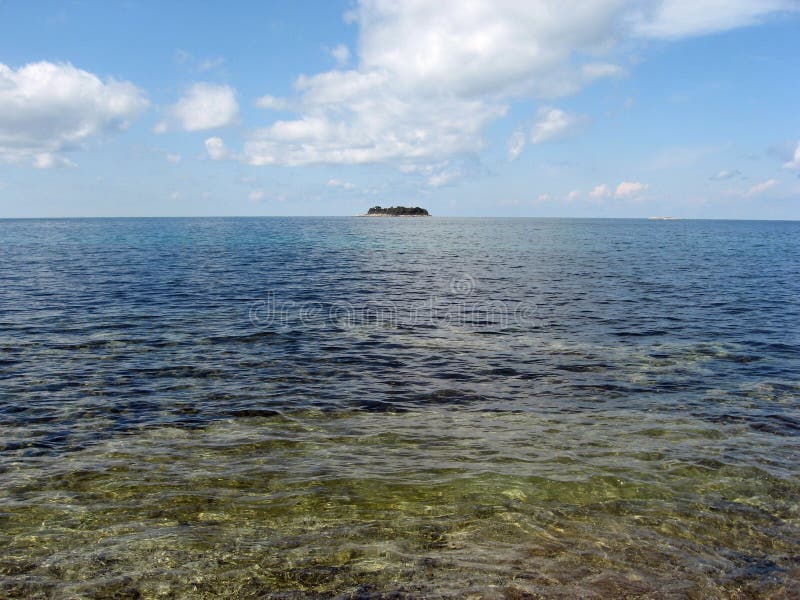 Lonely Island Lost in the Midst of the Blue Sea Stock Photo - Image of ...