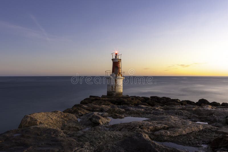 Lonely Lighthouse at Sunrise Stock Image - Image of dramatic ...