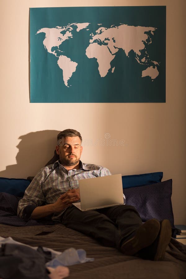 Lonely male using laptop stock image. Image of computer - 61872857