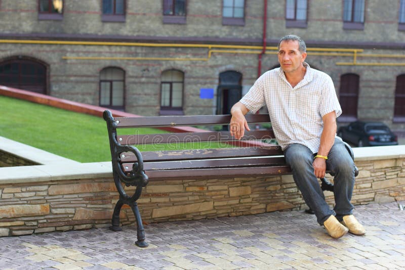 Lonely man on the bench stock photo. Image of landscape - 78018018