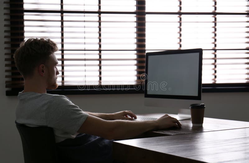 Lonely Man Sitting at Computer with Empty Screen Stock Photo - Image of ...