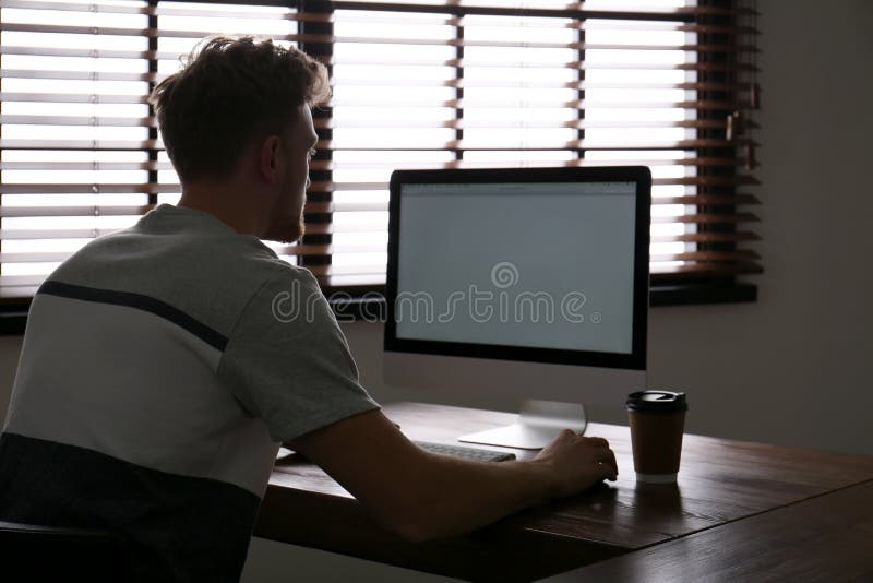 Lonely Man Sitting at Computer with Empty Screen Stock Photo - Image of ...