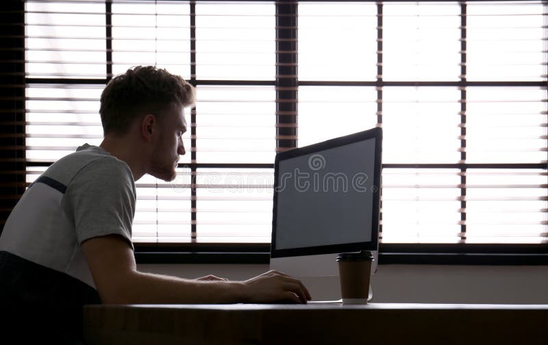 Lonely Man Sitting at Computer with Empty Screen Stock Photo - Image of ...