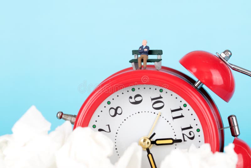 Lonely Old Man Model Above the Alarm Clock Stock Image - Image of alarm ...