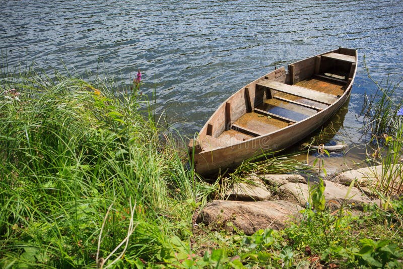 Lonely rowing boat stock photo. Image of vertical, boat - 75890904