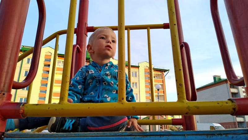 Lonely Sad Kid in Blue Clothes on the Playground Stock Image - Image of ...