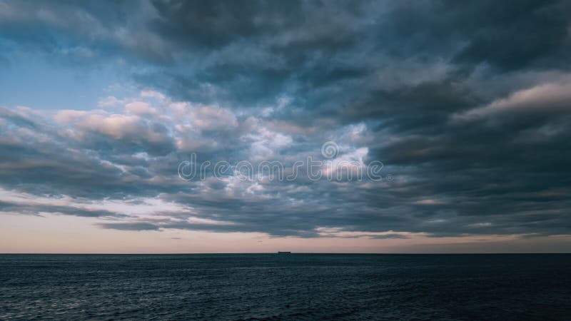 Lonely Ship on the Horizon, Evening Dramatic Sky with Clouds, Calm Dark ...
