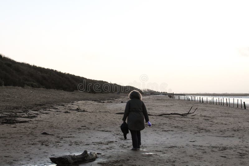 Lonely walk on the beach stock photo. Image of brean - 165077416