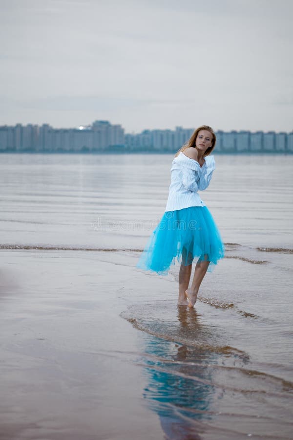 Lonely woman on the beach stock image. Image of nature - 25454367