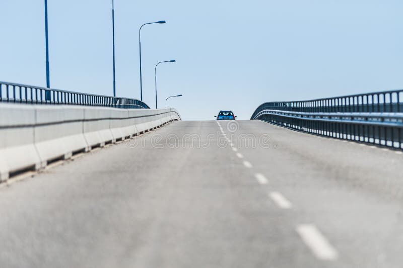 A Lonesome Car Driving Over a Bridge Stock Image - Image of freeway ...