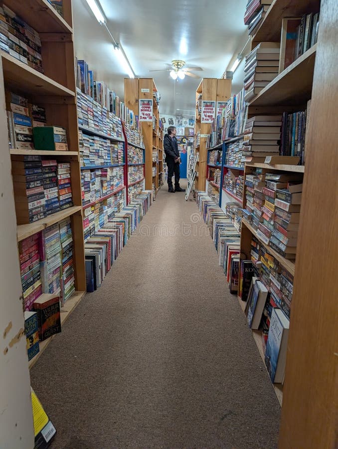 Long Aisle at a Book Shop with Shelves and Patron Editorial Image ...