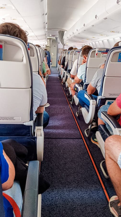 Long Aisle between Seats in the Airplane Cabin Editorial Image - Image ...