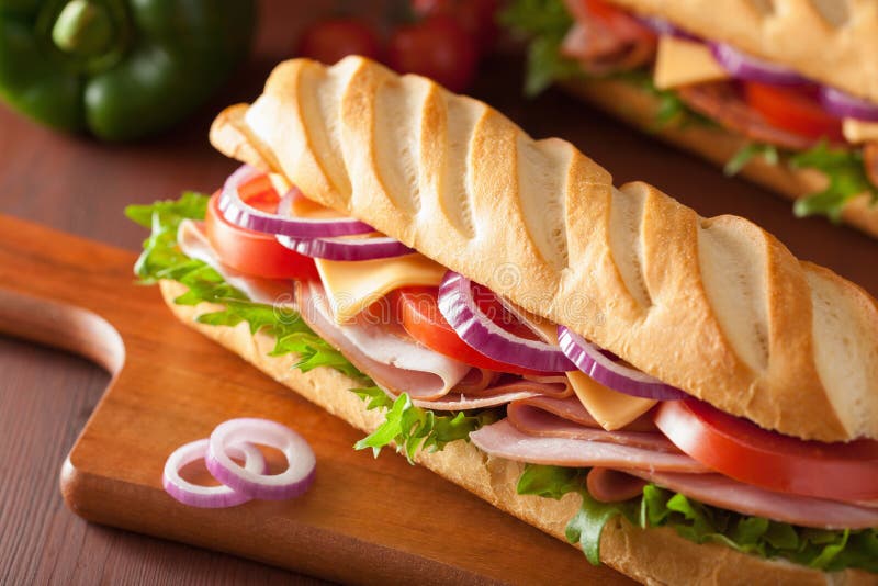 Long Baguette Sandwich with Ham Cheese Tomato and Lettuce Stock Photo ...