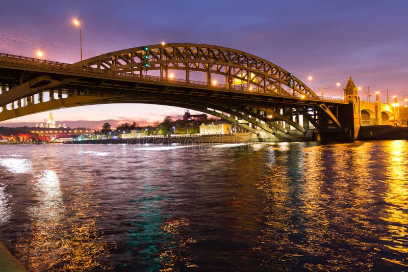 The Long Beautiful Bridge Across the River in the Evening. Stock Image ...