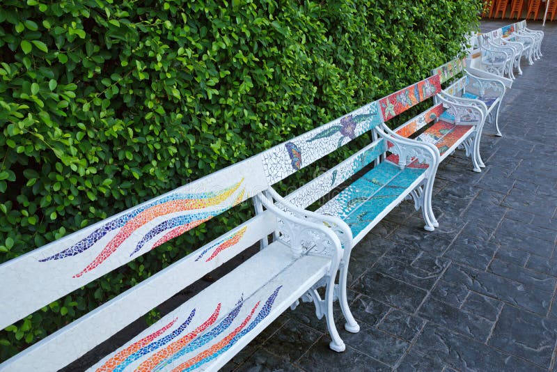 Long bench in the park stock photo. Image of sitting - 122874110