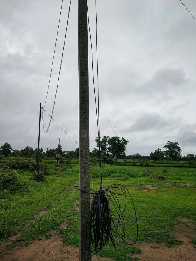 The Long Black Wire is Bound and Hanging on the Pole. Stock Image ...