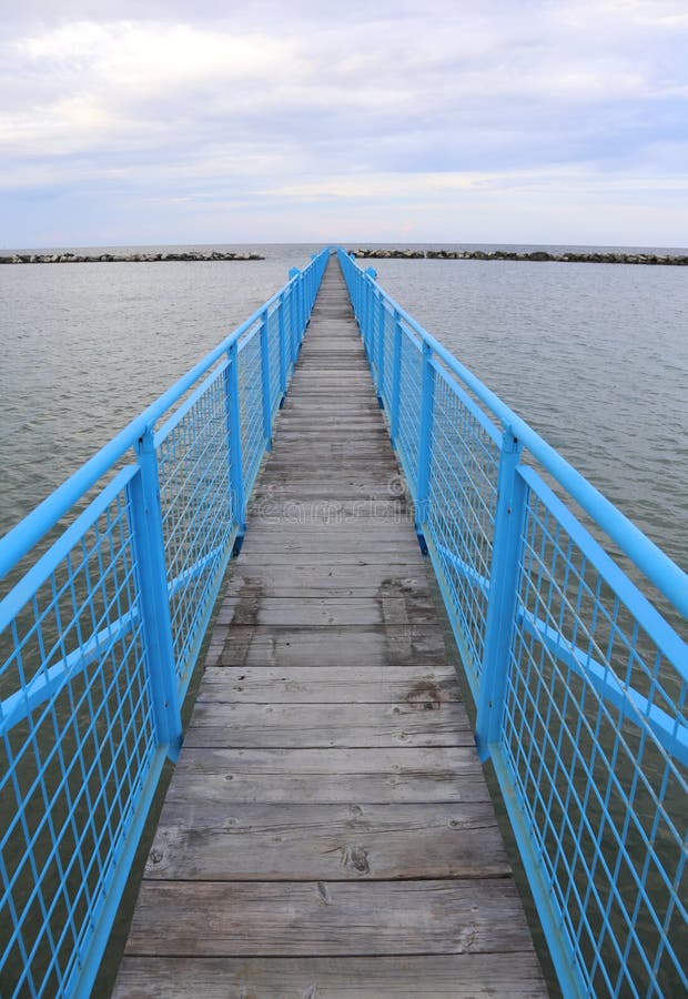 Long Blue Bridge To Dock Ships Stock Image - Image of water, bridge ...
