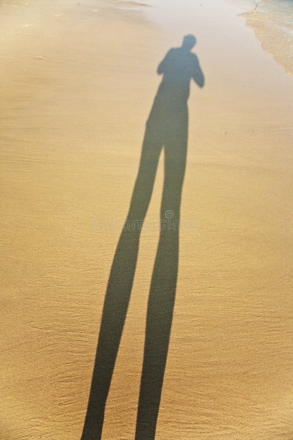 Long Body Shadow of a Man in the Fine Sand of the Beach, Feet is Stock ...