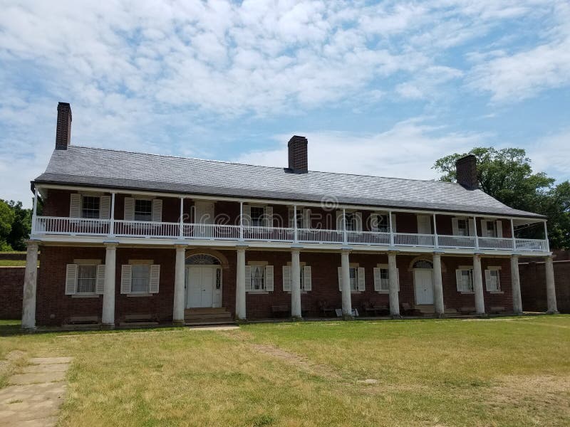 Long Brick Building with White Columns Stock Photo - Image of building ...