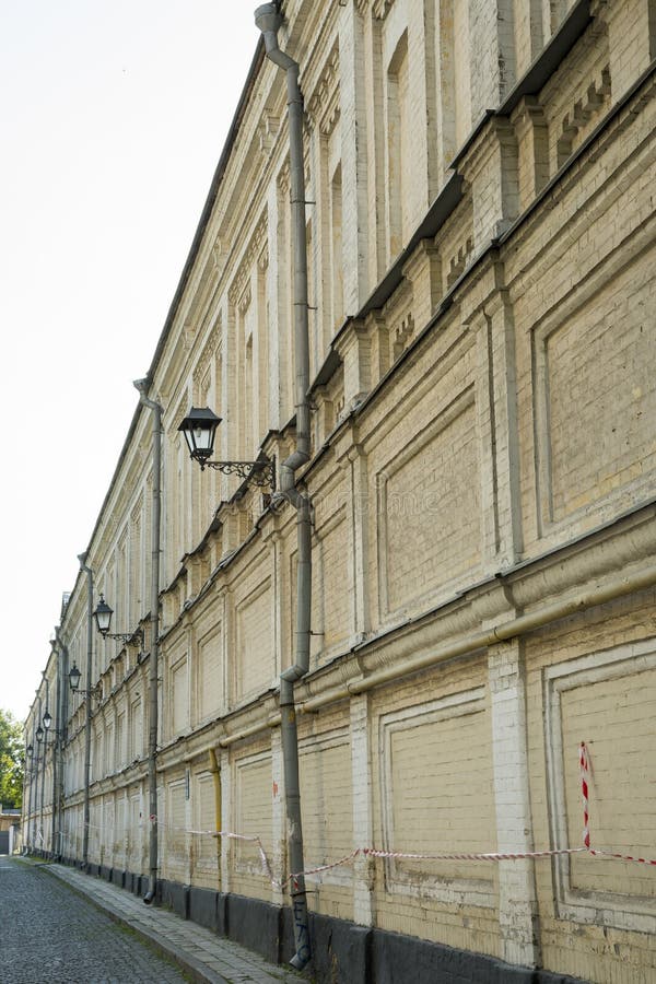 Long Brick Wall of an Old Building. Vertical Photo Stock Photo - Image ...