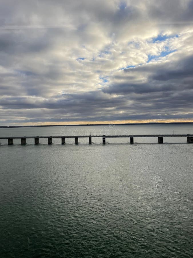 Long Bridge in the Ocean Under the Dark Clouds Stock Image - Image of ...