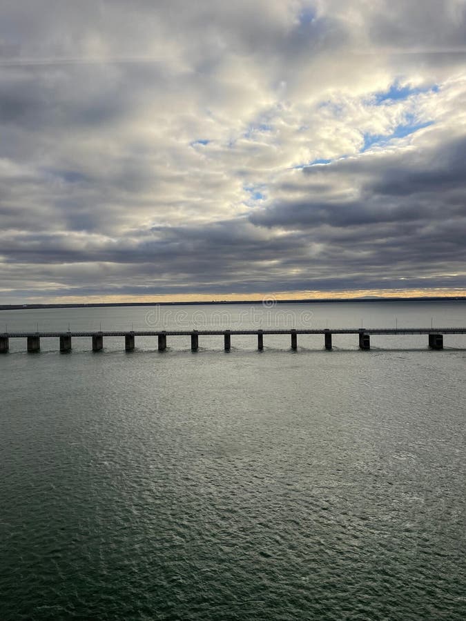 Long Bridge in the Ocean Under the Dark Clouds Stock Image - Image of ...