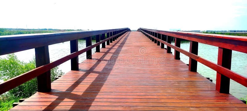 Long bridge over the bay editorial stock image. Image of flooring ...