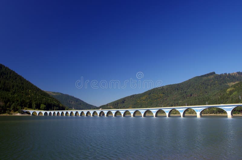 Long bridge over lake stock image. Image of scenic, scenery - 29549009