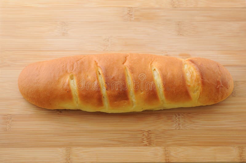 Long Butter Bread on Cutting Board Stock Photo - Image of crust ...