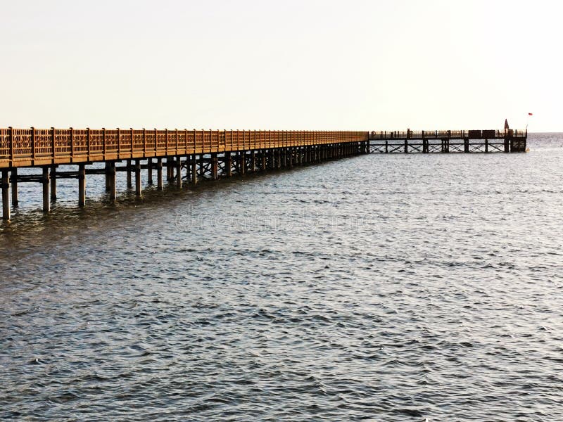 Long catwalk and mole stock photo. Image of wharf, orange - 189621644