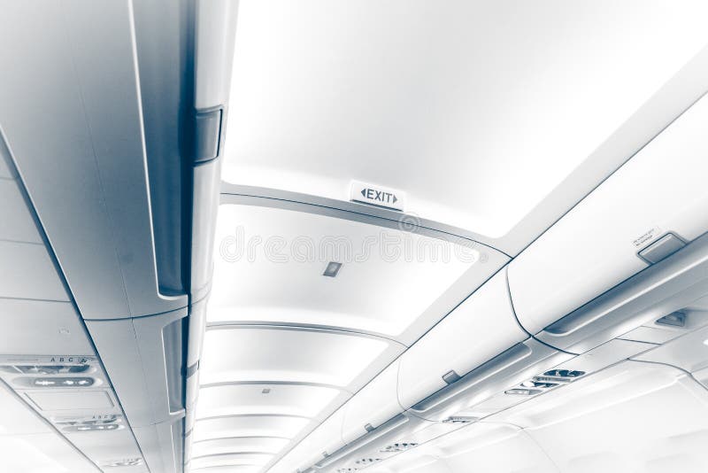 Long Ceiling in Airplane with Exit Sign Stock Image - Image of corridor ...