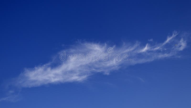 A Long Cloud in the Sky with a Blue Sky Background Stock Image - Image ...