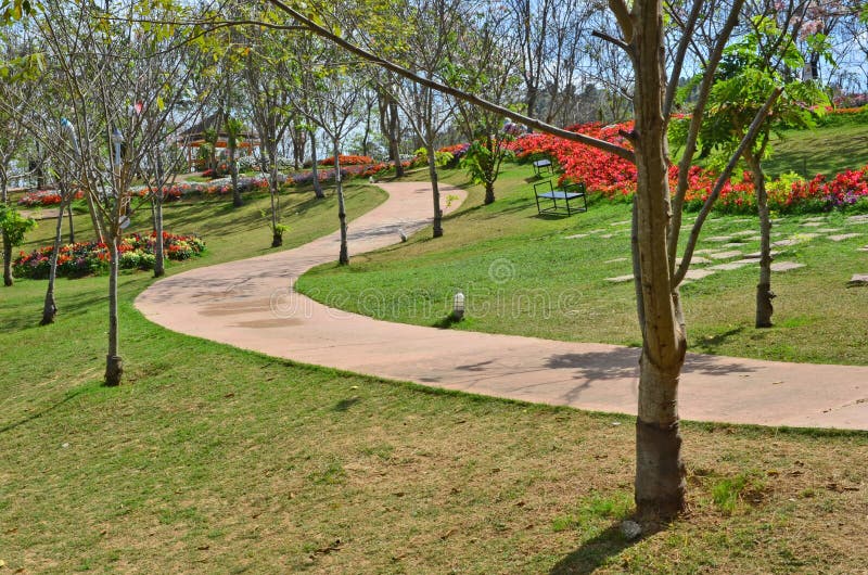 Long Concrete Pathway in the Park Stock Photo - Image of floral ...