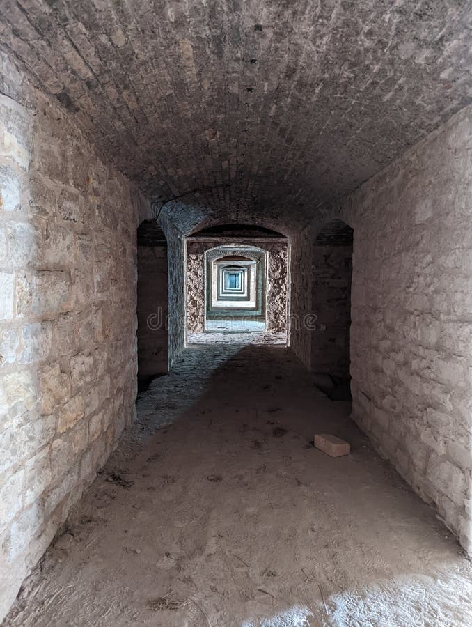 Long Corridor in Catacombs Under Old Factory Stock Image - Image of ...
