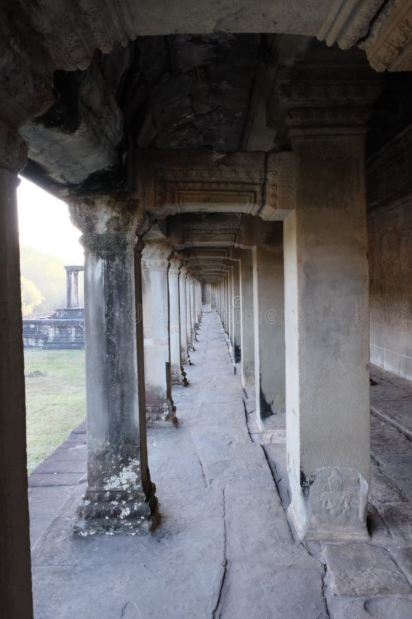 A Long Corridor with a Colonnade. Old, Abandoned Building of the Khmer ...