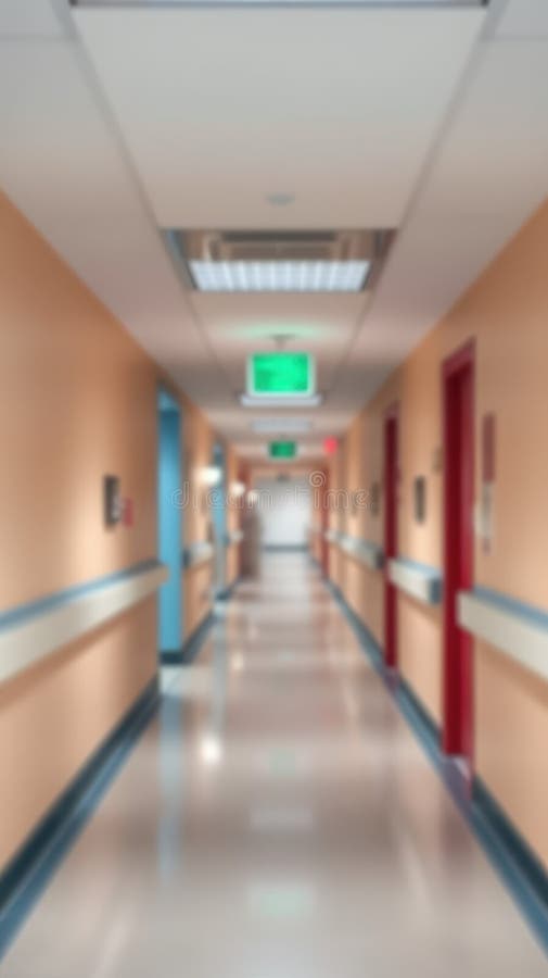 Long Corridor of a Hospital with Clear Emergency Exit Signs and Calm ...