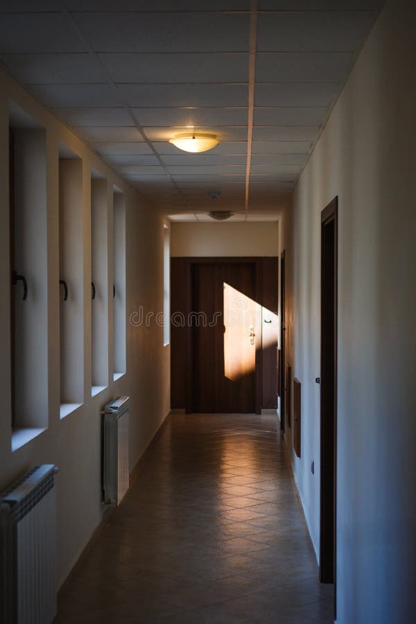 A Long Corridor in the Hotel with Windows and Doors. Stock Image ...