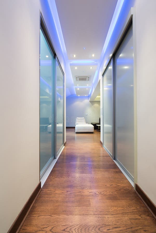 Long Corridor in Luxury Apartment with Colorful Ceiling Lights Stock ...