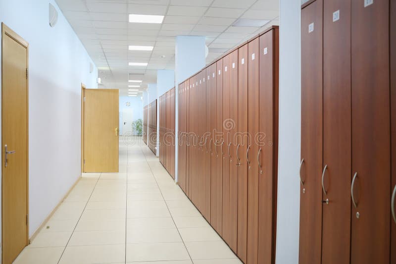 Long Corridor with Numerous Wooden Cabinets and Stock Photo - Image of ...