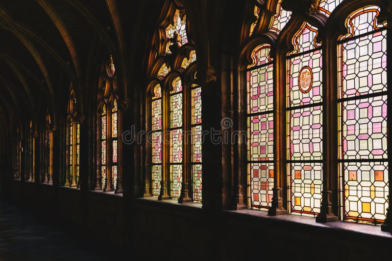 Long Corridor in a Monastery with Colourful Windows Stock Photo - Image ...